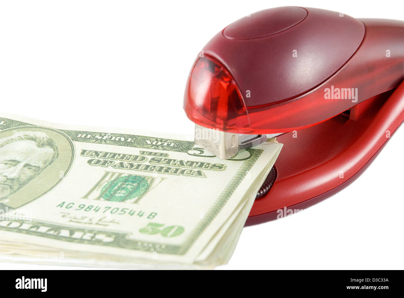 Stapler of red color and dollars Stock Photo - Alamy