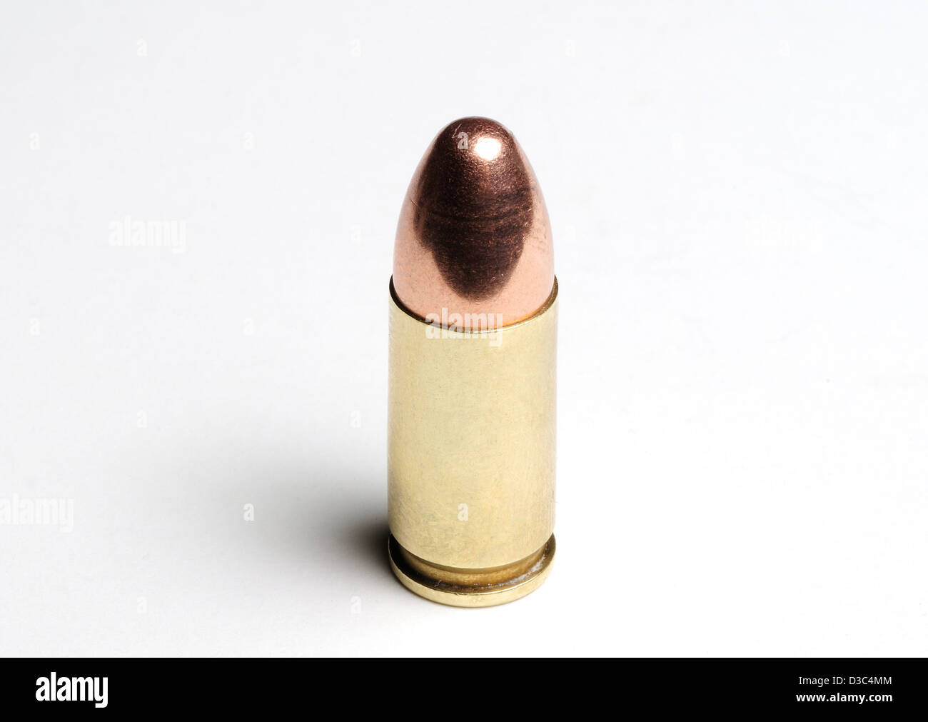 9mm Winchester Luger bullet against white backdrop Stock Photo - Alamy