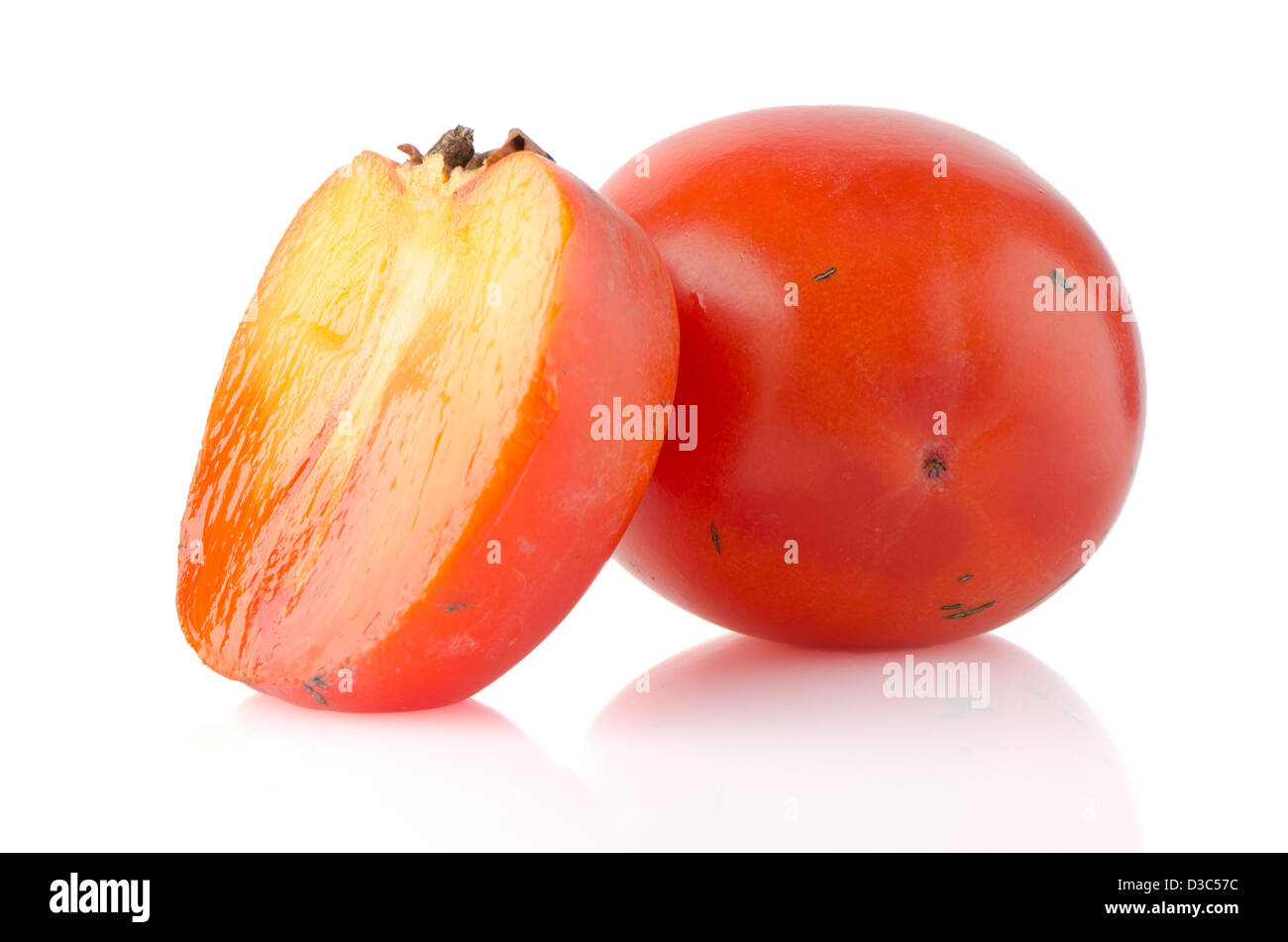 Ripe persimmons on white background Stock Photo - Alamy