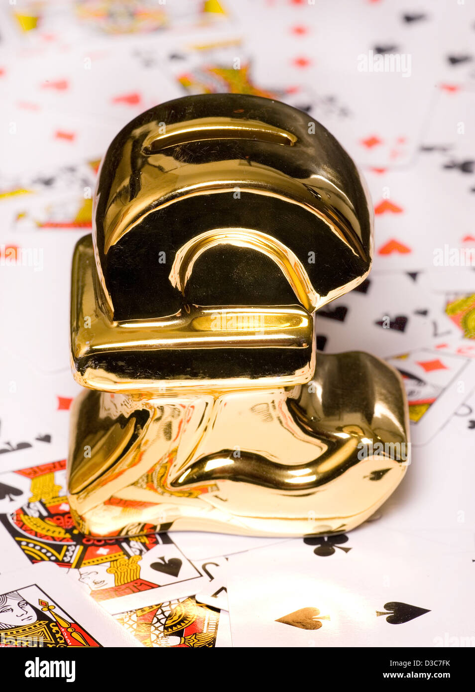 Pound money box on pack of cards background Stock Photo - Alamy