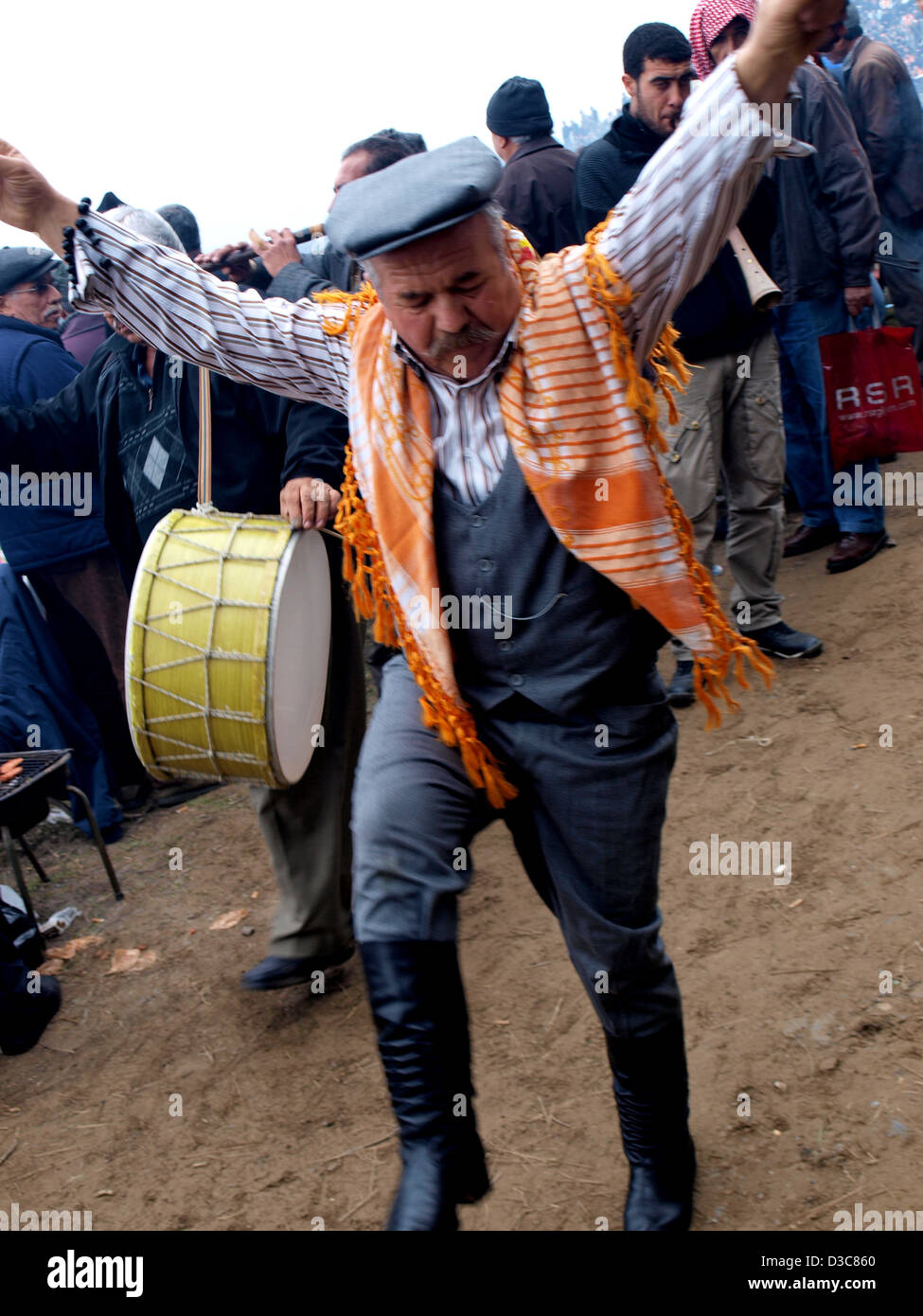 Man dancing Zeybek dance while musicians play during Selcuk-Efes Camel ...
