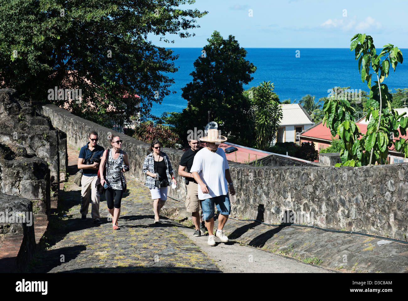 tourists and group visiting Historical city of Saint-Pierre, Martinique ...
