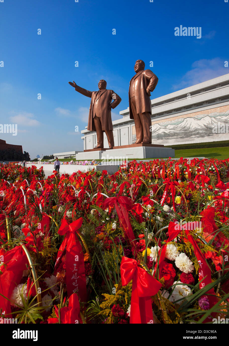 Baskets Of Flowers In Front Of The Two Statues Of The Dear Leaders In ...