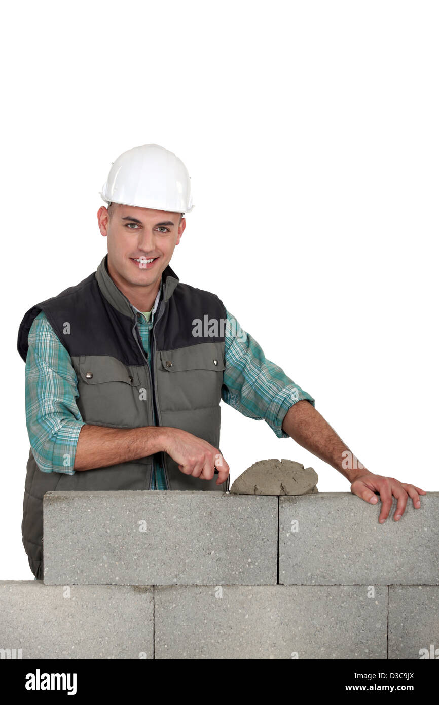 mason building a wall Stock Photo - Alamy