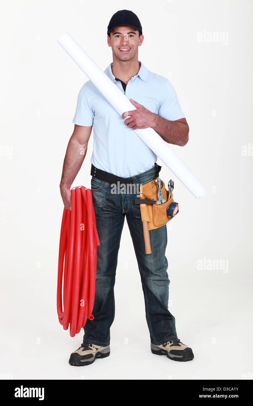 Plumber with piping Stock Photo - Alamy
