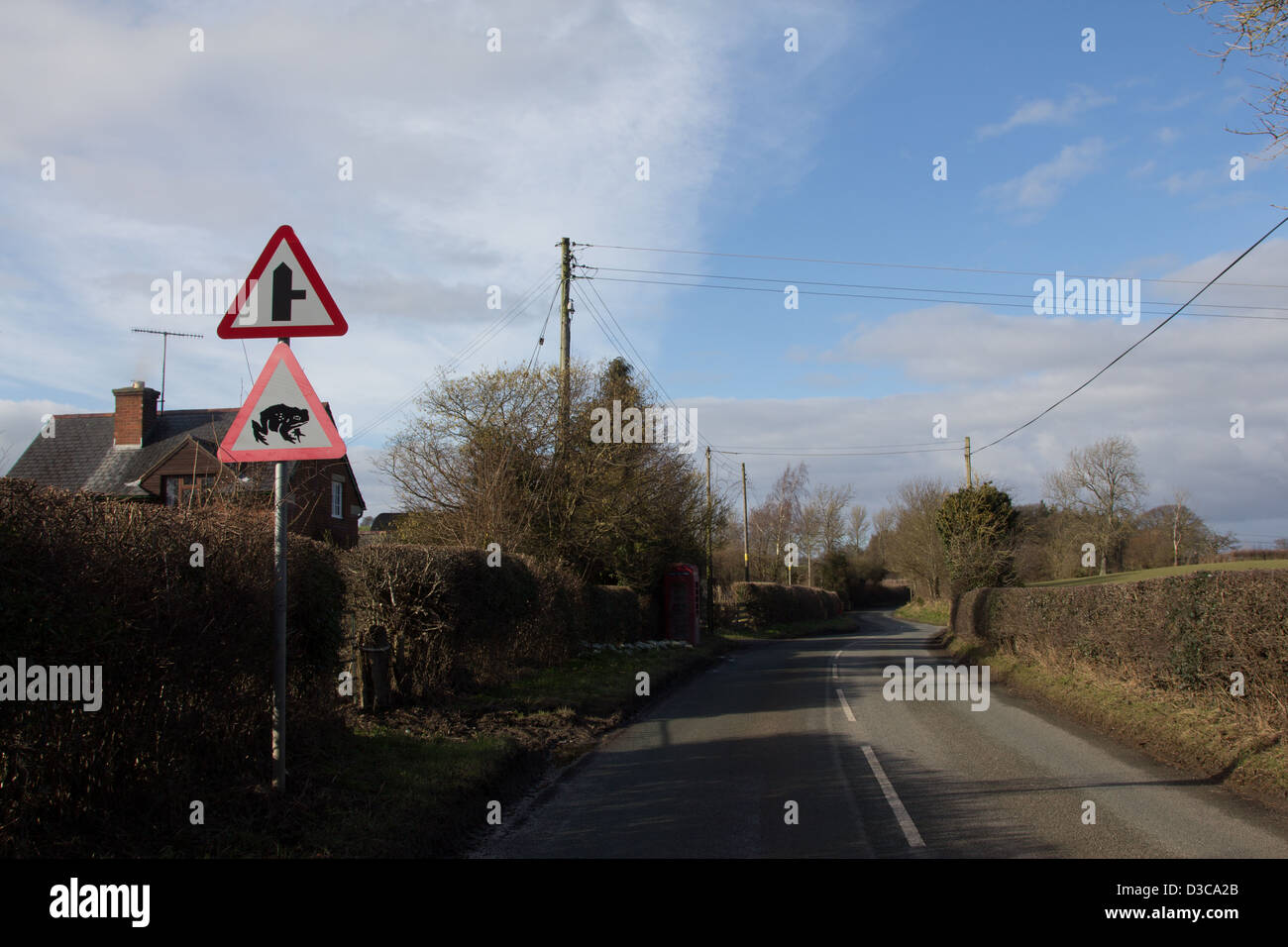 Frogs crossing warning triangle sign Stock Photo - Alamy