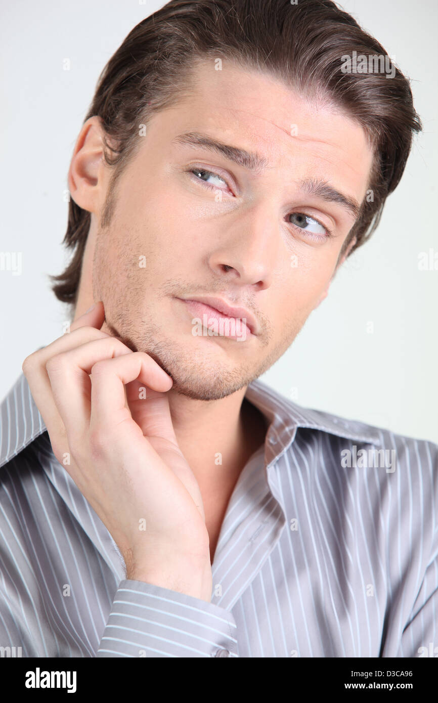 handsome guy puzzled Stock Photo - Alamy