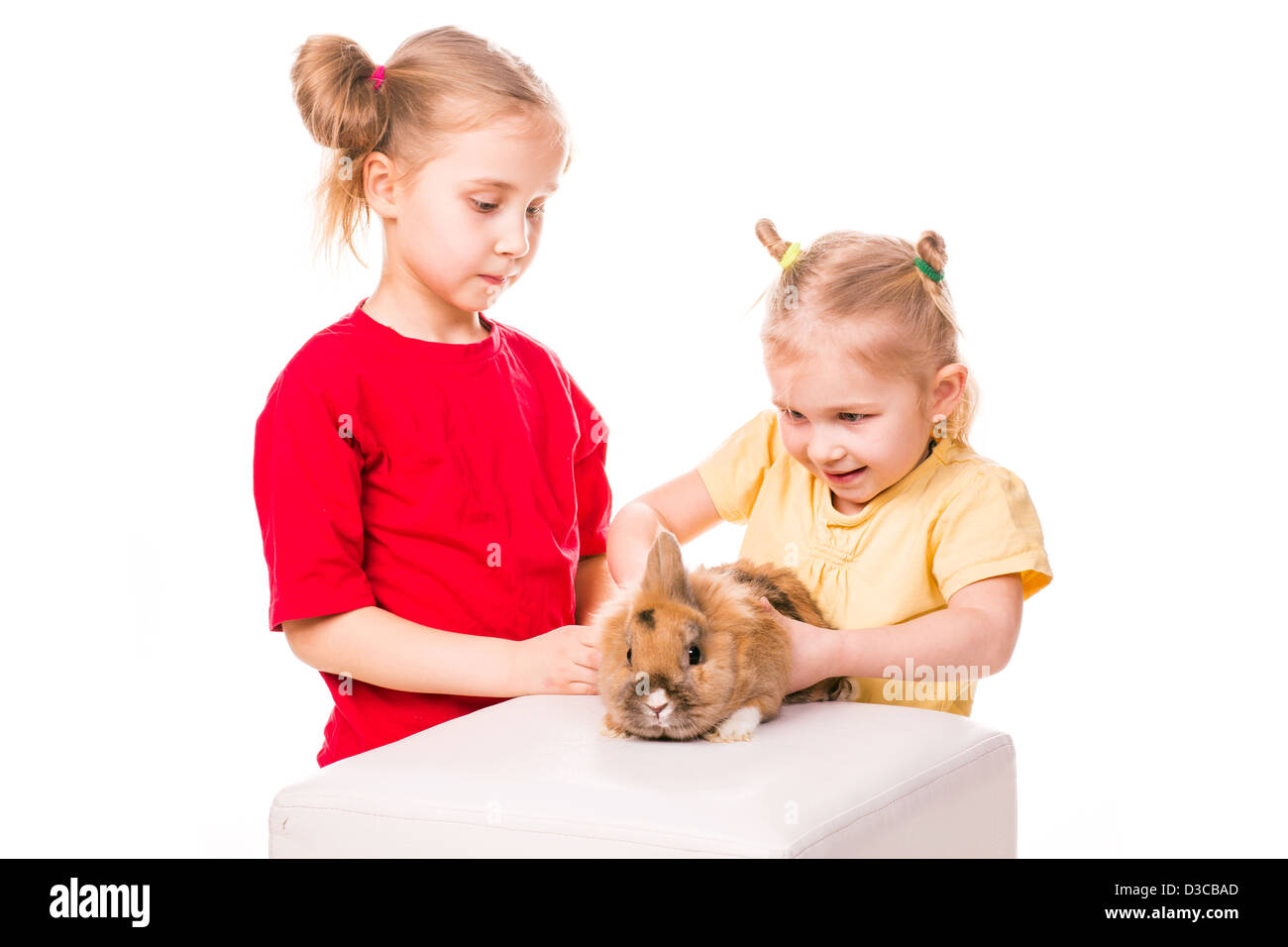 Two happy kids with easter bunny and eggs isolated on white. Happy ...