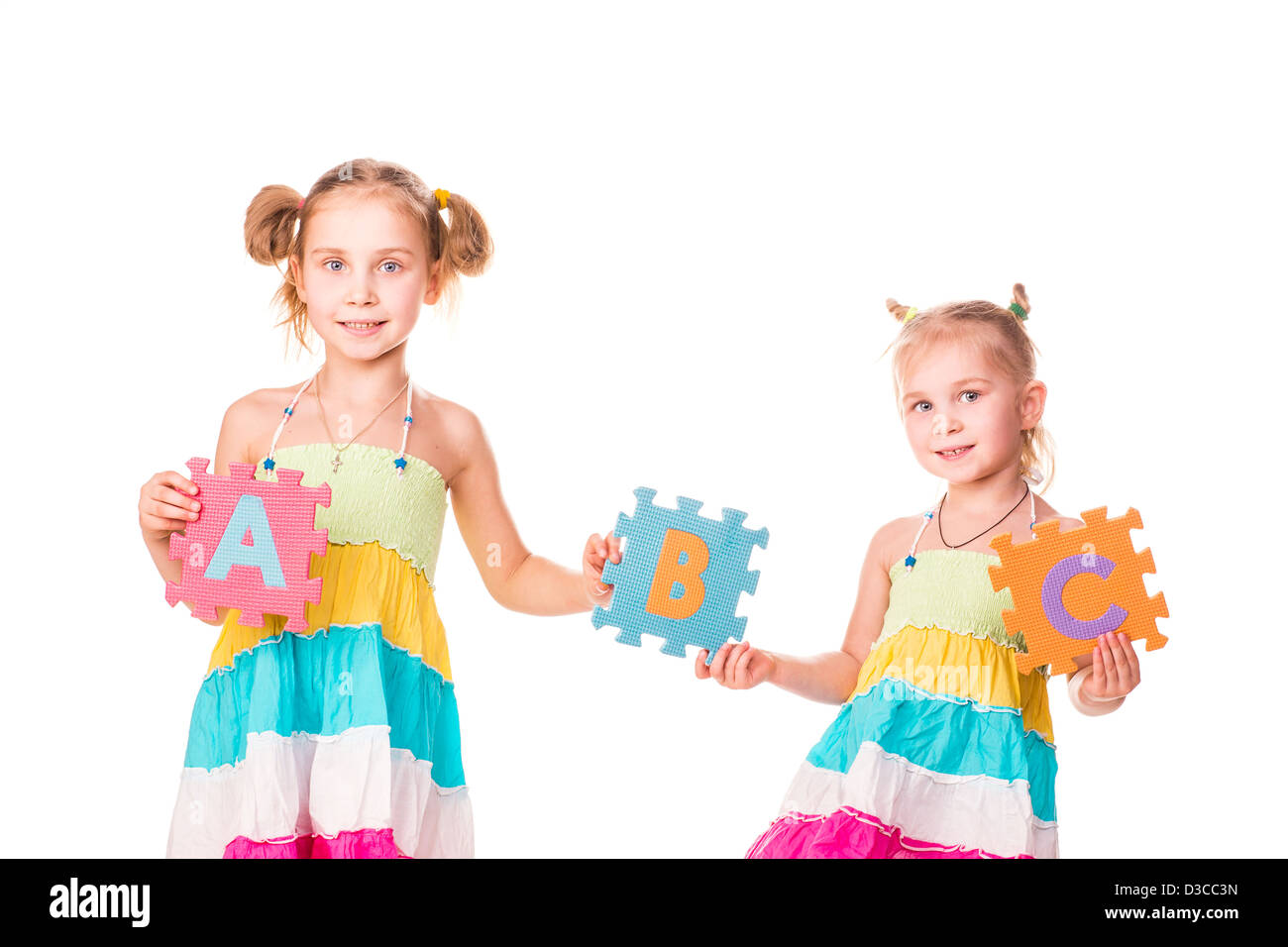 Happy kids holding alphabet letters ABC isolated on white Stock Photo ...