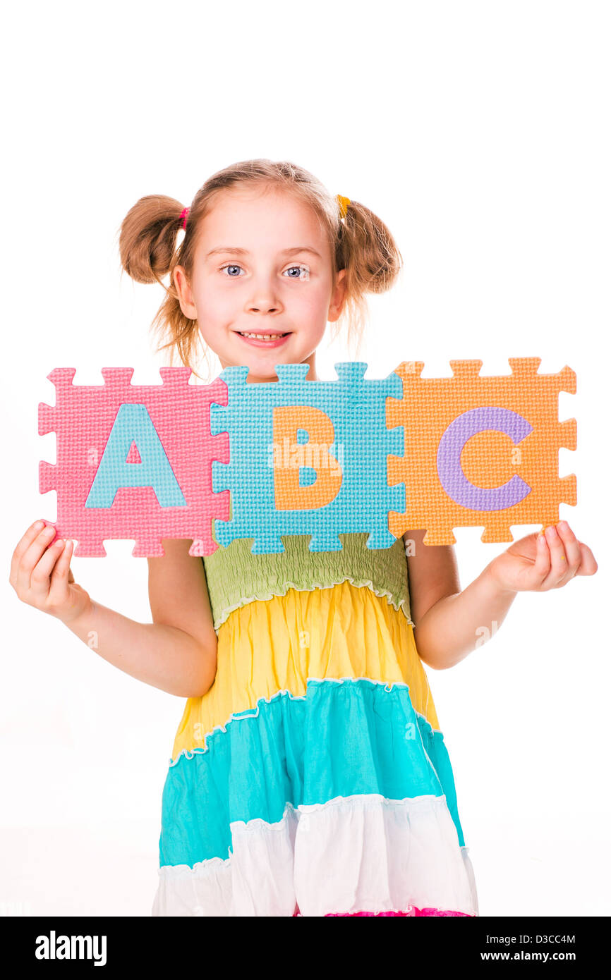 Happy girl holding alphabet letters ABC isolated on white Stock Photo ...