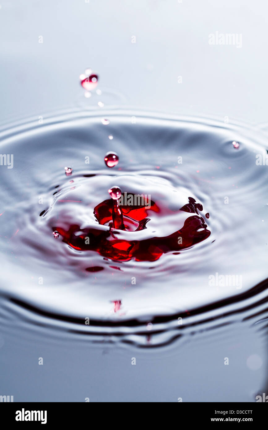 Close view of a droplet of wine hitting a surface of wine Stock Photo ...
