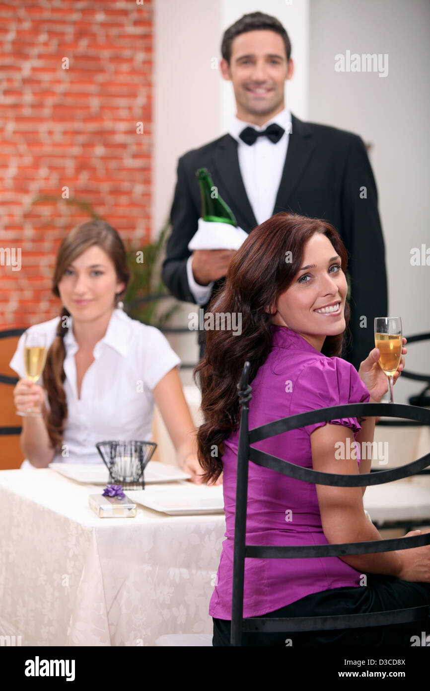 Waiter serving customers Stock Photo - Alamy