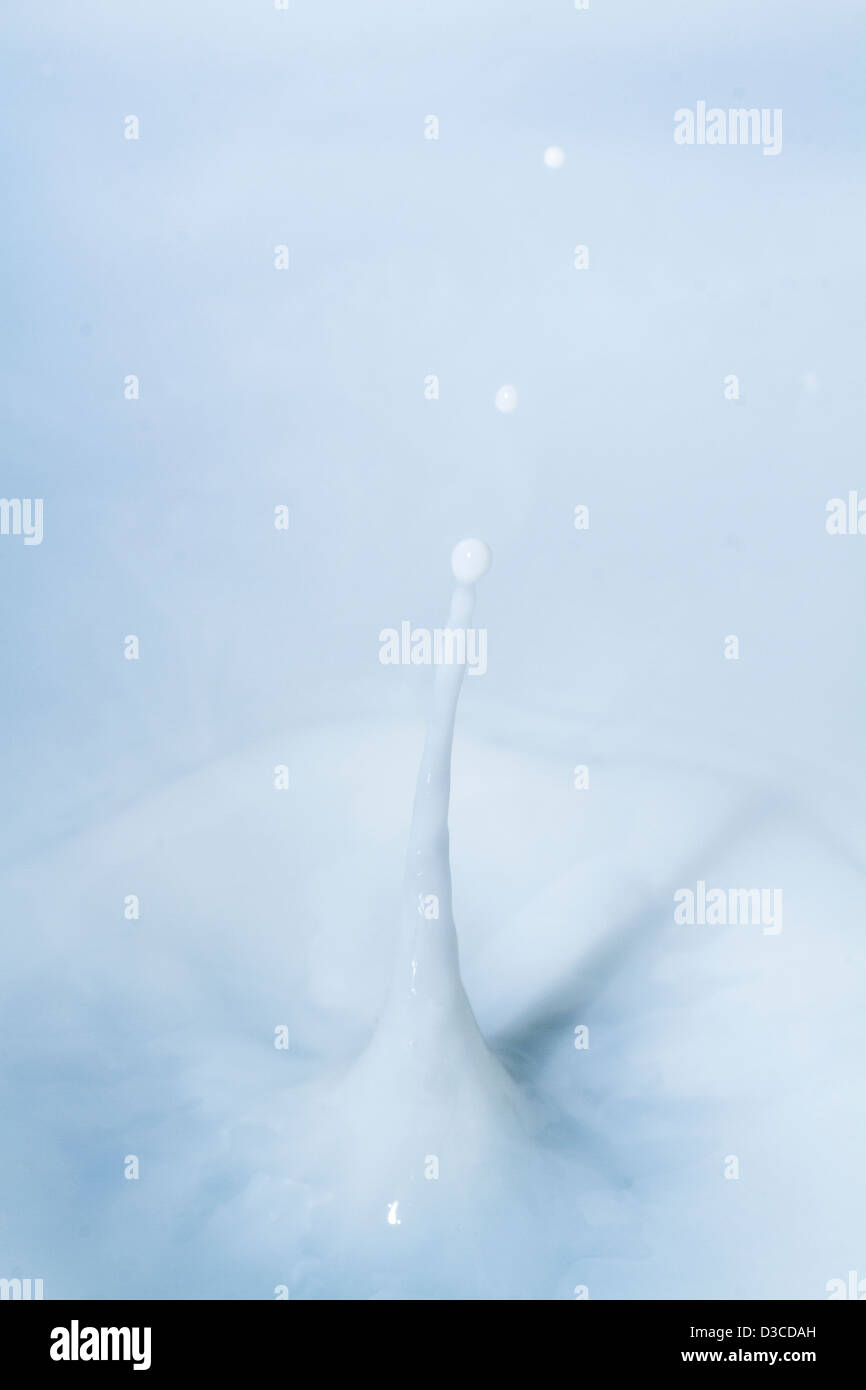 Close view of a droplet of milk hitting a surface of milk Stock Photo ...
