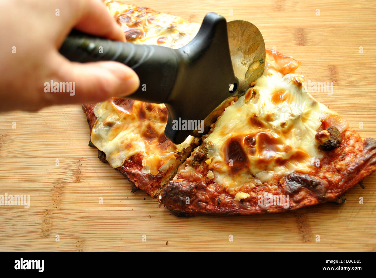 Slicing Homemade Pizza Stock Photo - Alamy