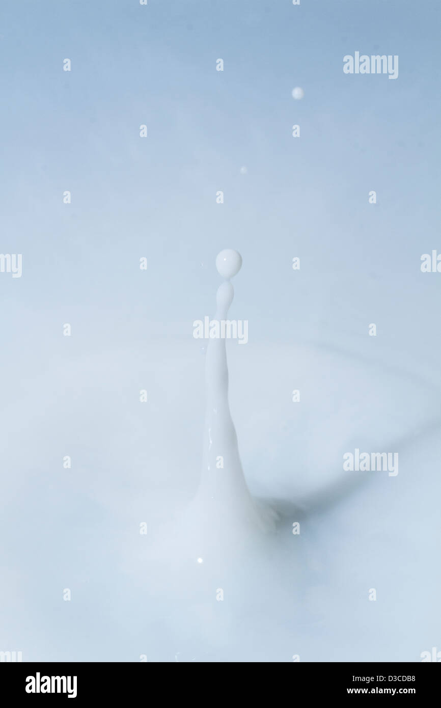 Close view of a droplet of milk hitting a surface of milk Stock Photo ...