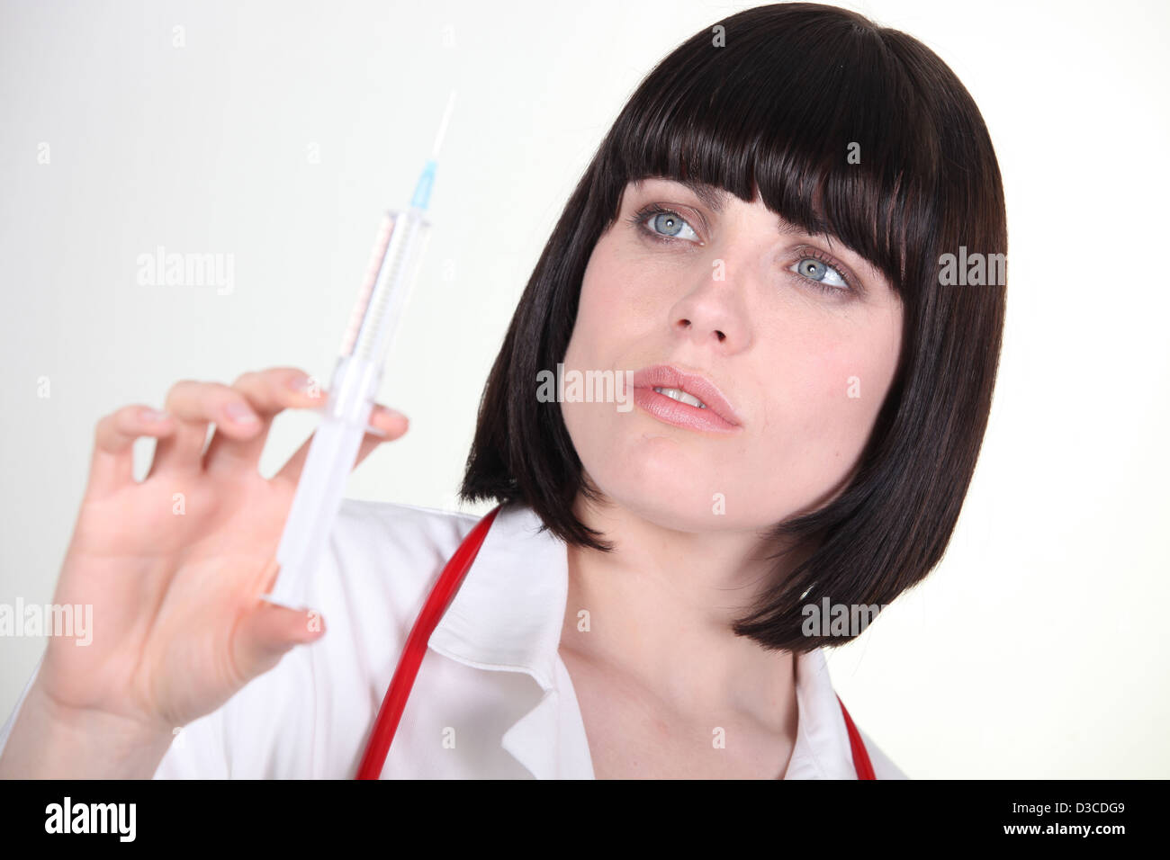 a woman taking a syringe Stock Photo - Alamy