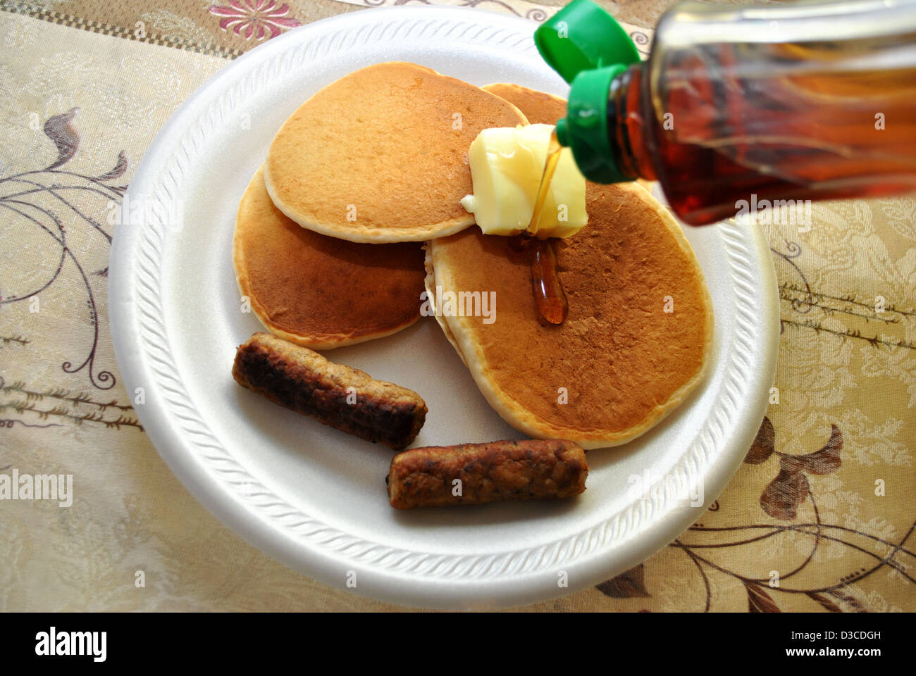 Pouring Syrup on Hot Pancakes Stock Photo - Alamy