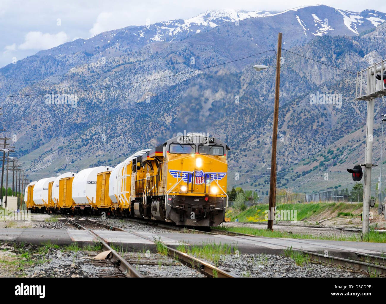 NASA’s space shuttle, accompanied by a train transporting solid rocket ...