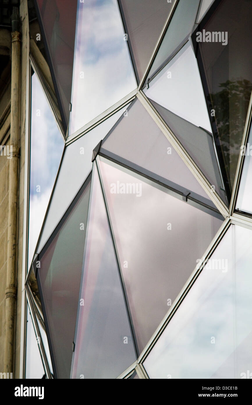 View of a curious modern building with red glass windows Stock Photo ...