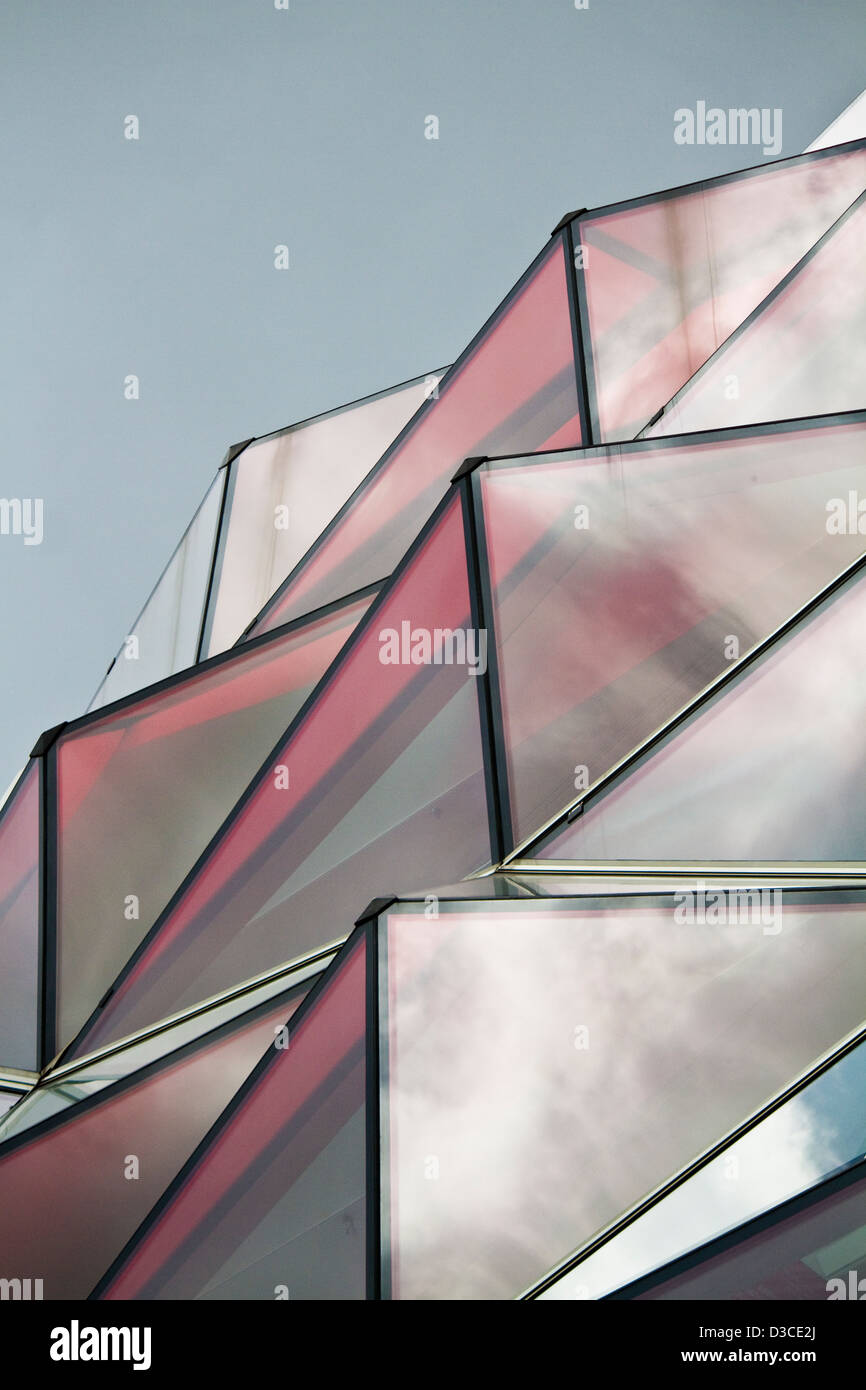 View of a curious modern building with red glass windows Stock Photo ...