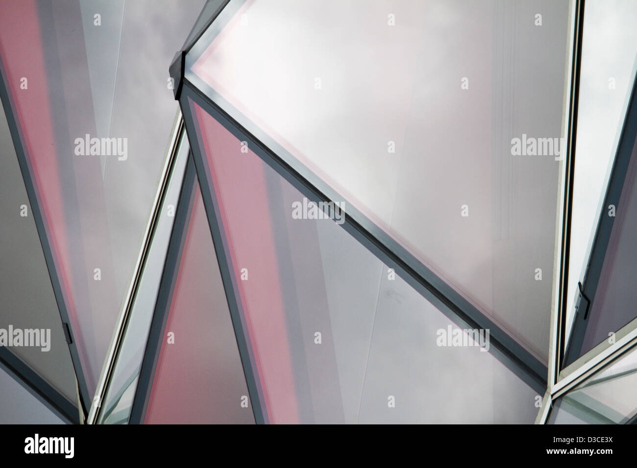 View of a curious modern building with red glass windows Stock Photo ...
