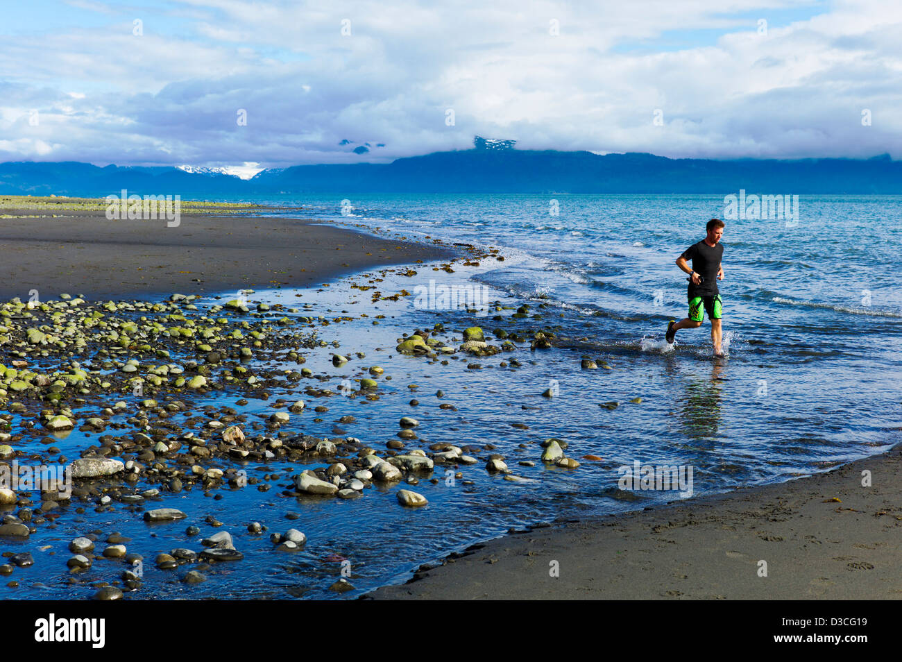 Man running hard on Bishop Beach, Homer, Alaska, USA Stock Photo - Alamy