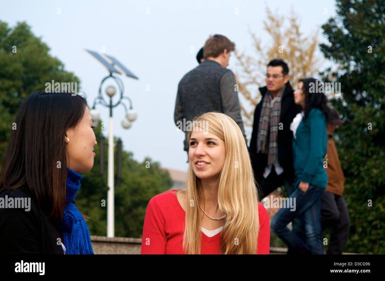 Female college students outdoor talking Stock Photo - Alamy