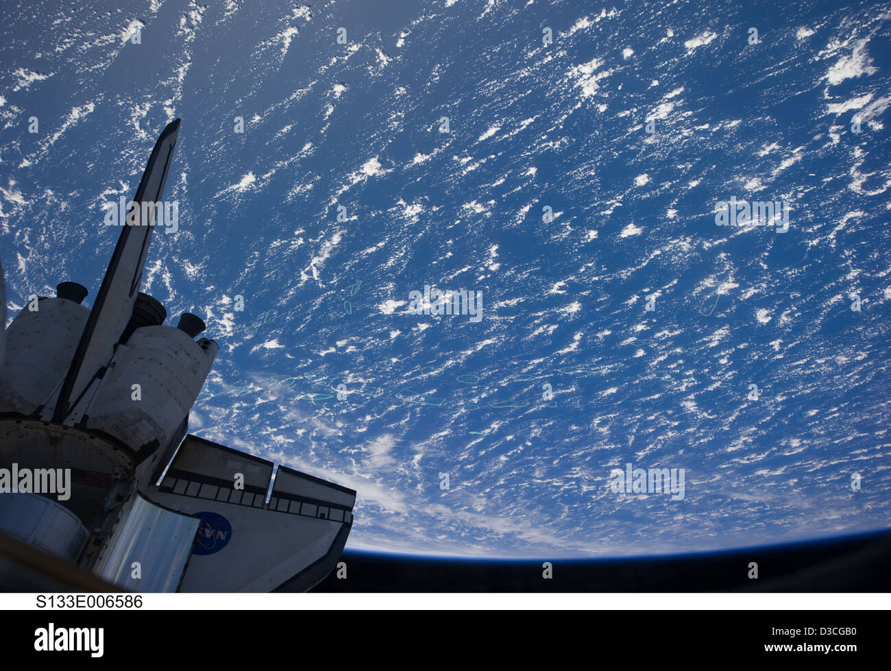 The Space Shuttle Discovery flies over Earth during its mission to the ...