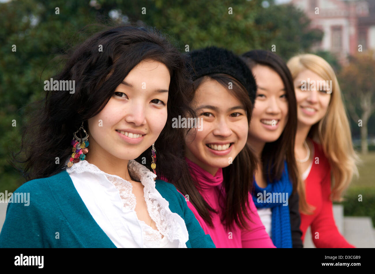 Female college students outdoor in a line portrait Stock Photo - Alamy