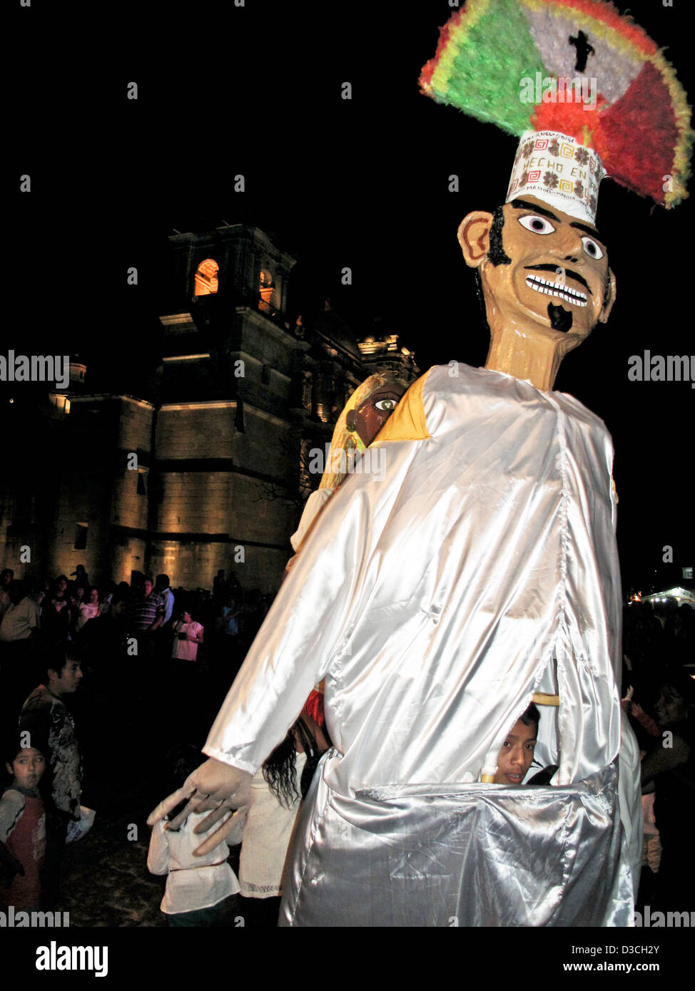 giant puppet with papier mache head & feathered headdress in front of ...