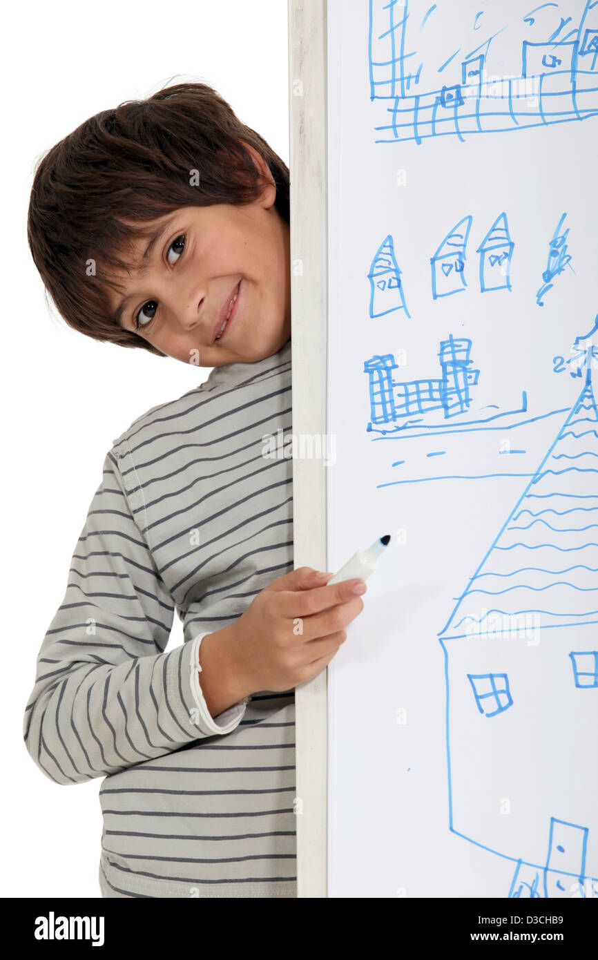 Young child standing behind his drawing Stock Photo - Alamy