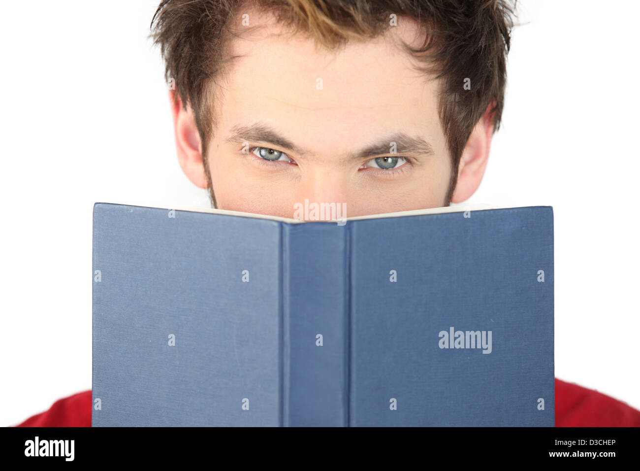 Man covering his face with the bible Stock Photo - Alamy