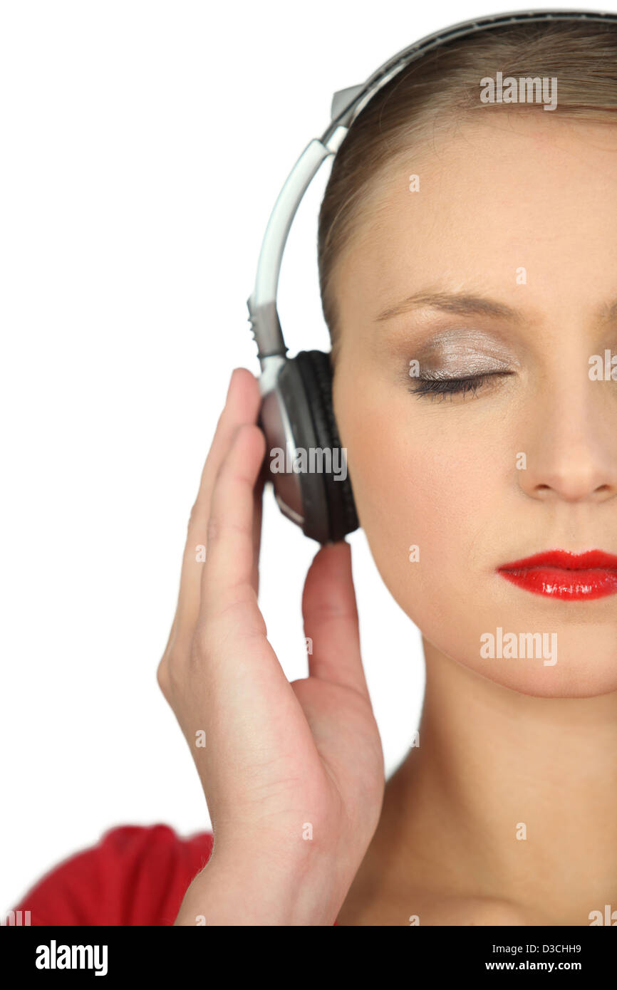 Woman enthralled by her music Stock Photo - Alamy