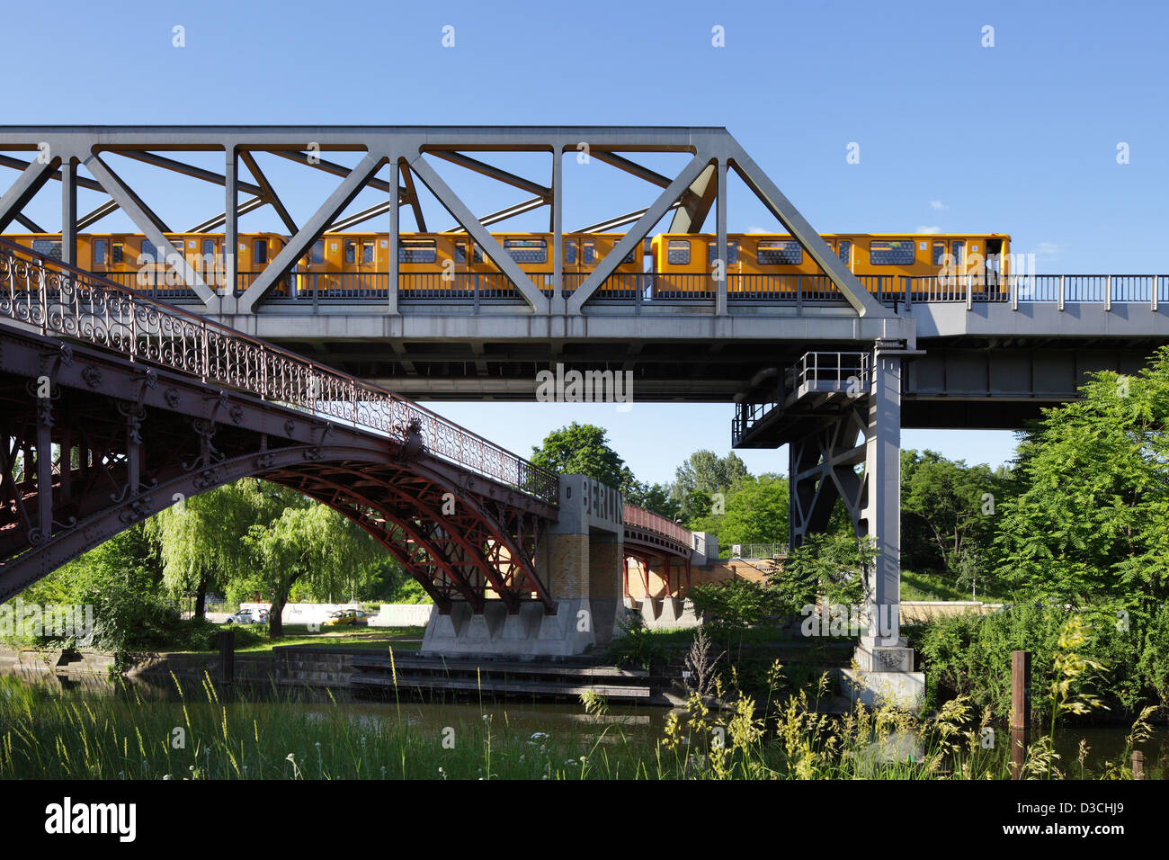 Berlin, Germany, subway on the elevated train line and the footbridge ...