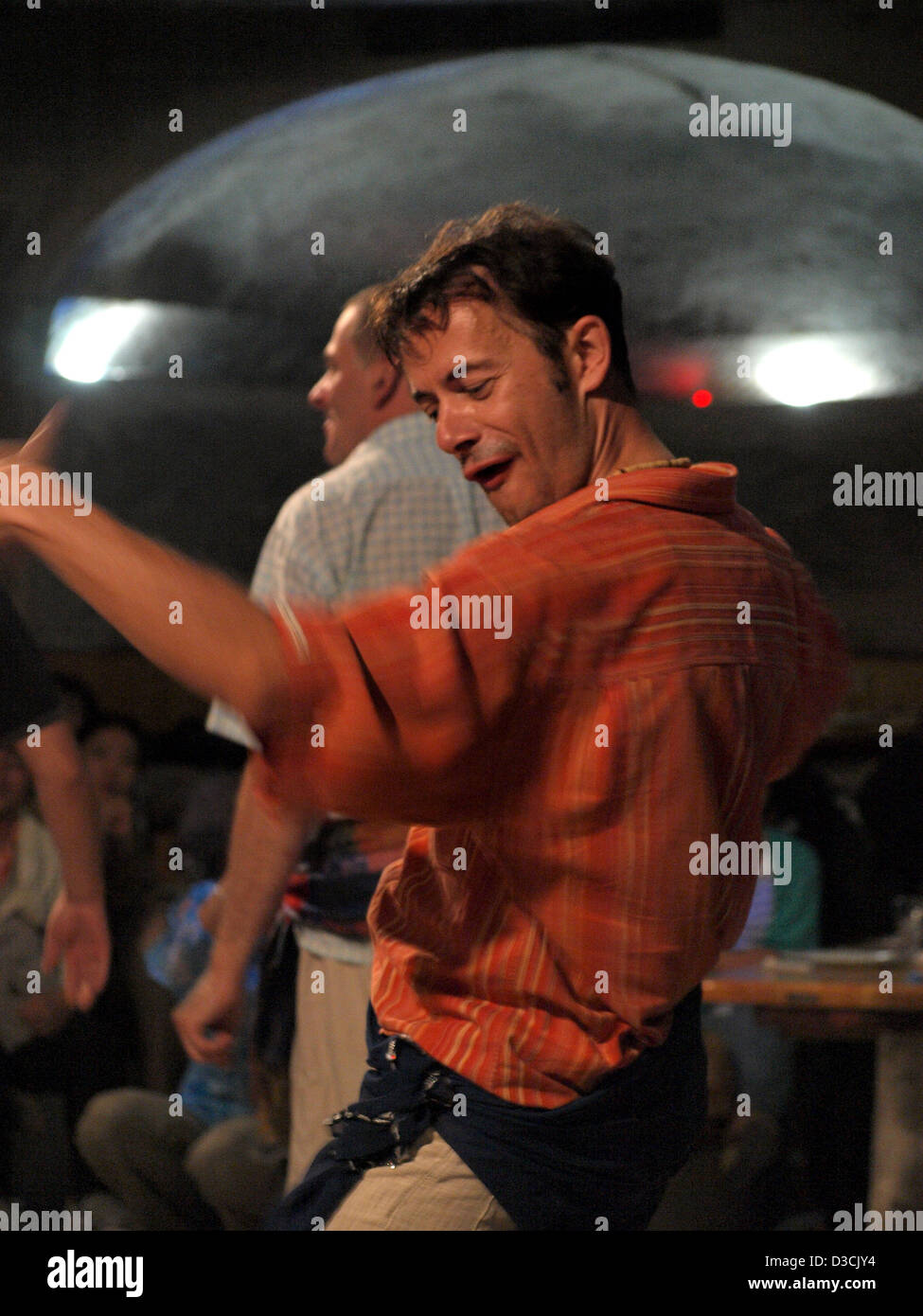 Western tourist dancing during Turkish Night Show of traditional dances ...