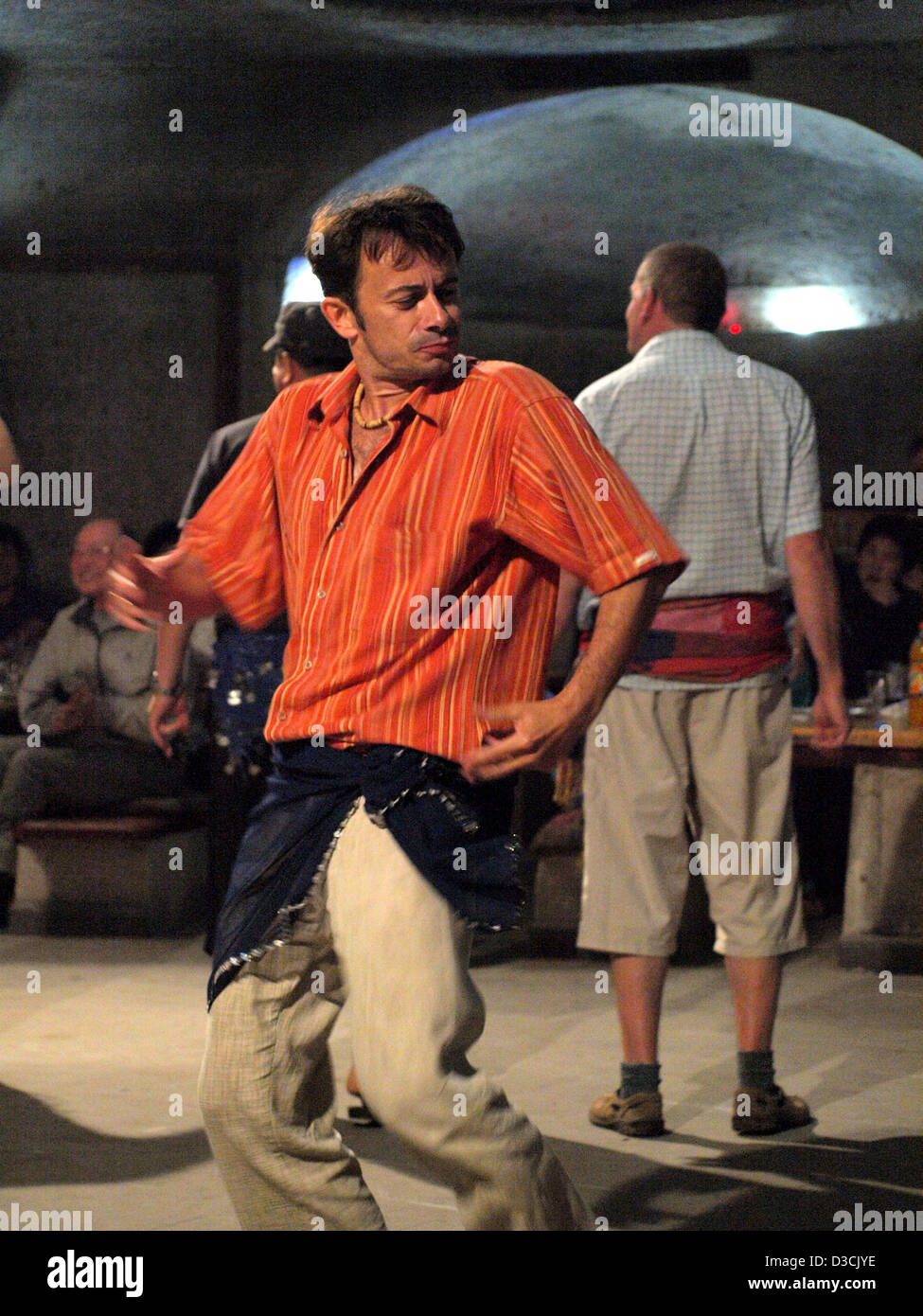 Western tourist dancing during Turkish Night Show of traditional dances ...