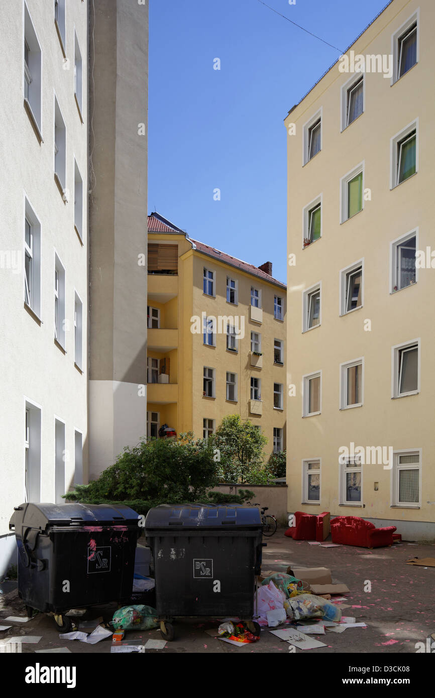 Berlin, Germany, bulky refuse and garbage cans in a back alley in the ...