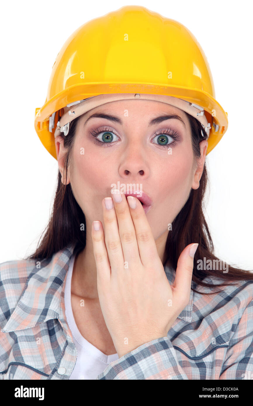 Shocked female builder Stock Photo - Alamy