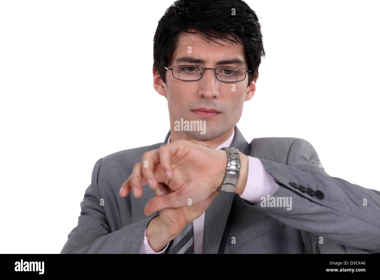 Businessman observing his watch Stock Photo - Alamy