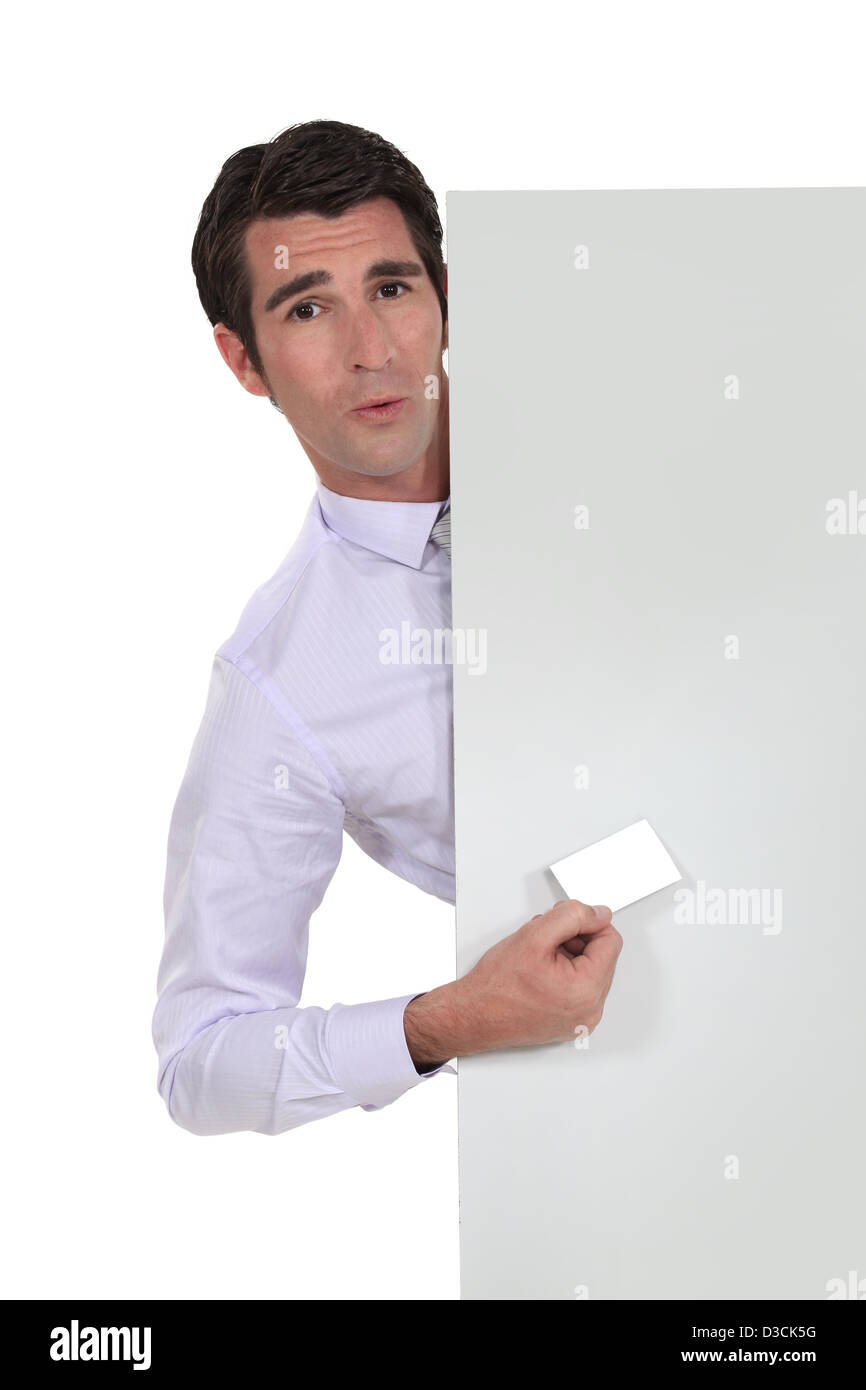 Man with business card and advertising panel Stock Photo - Alamy