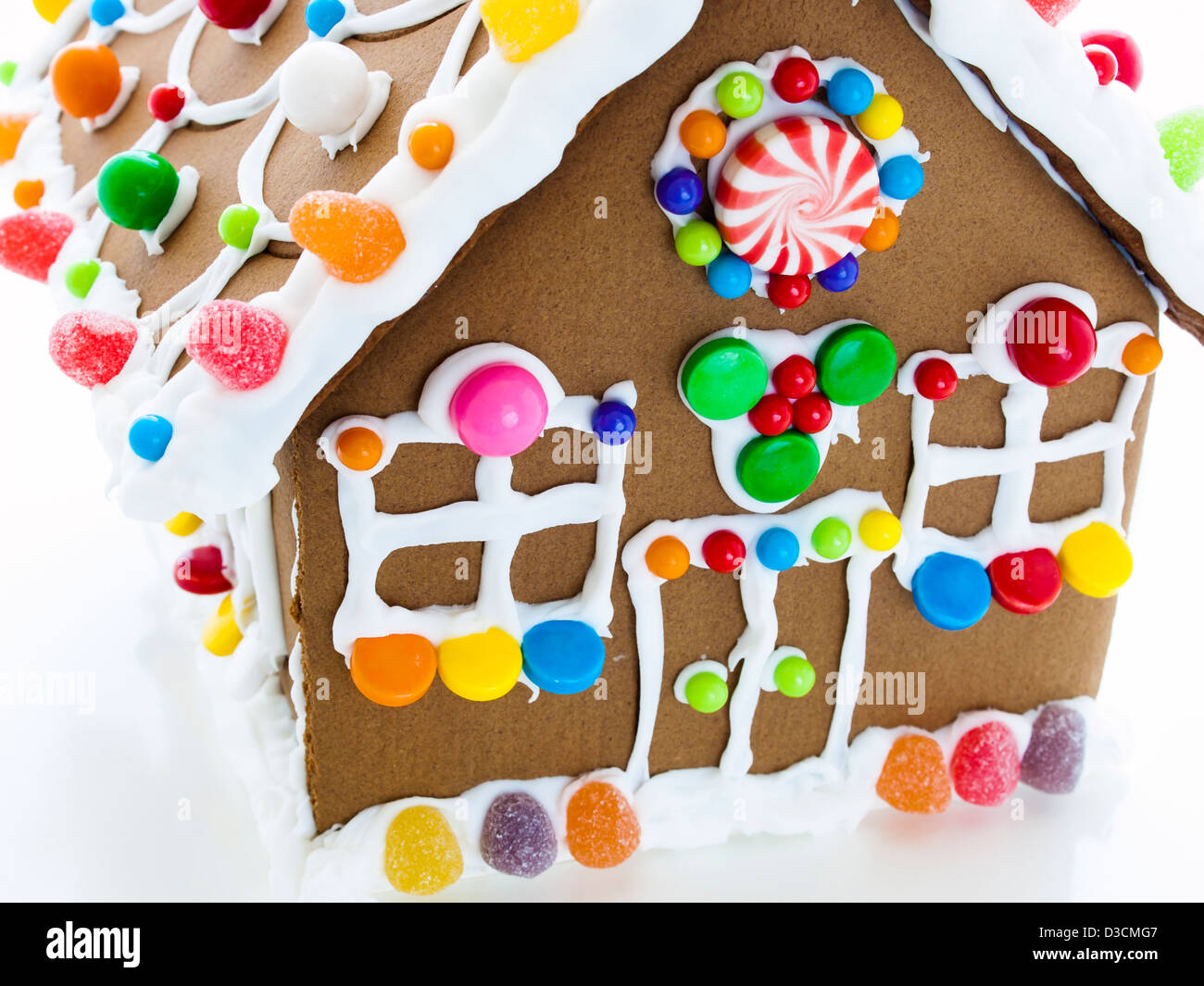 Decorated gingerbread house on white background Stock Photo - Alamy