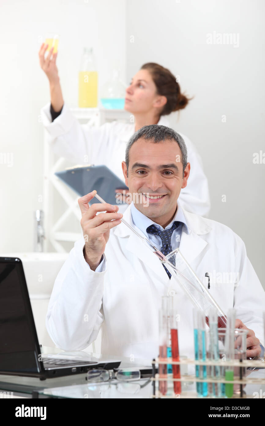 Scientists conducting experiments Stock Photo - Alamy