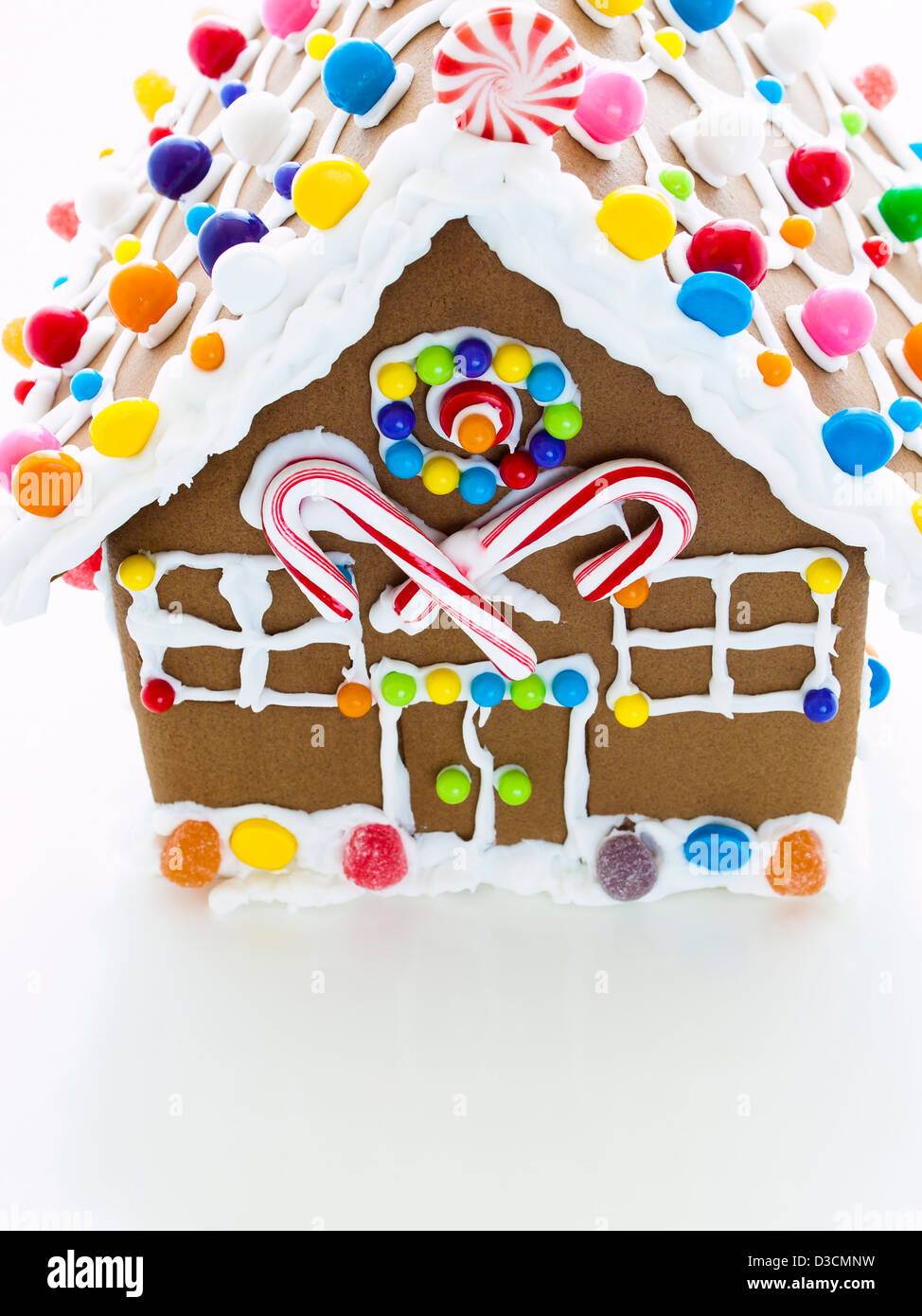 Decorated gingerbread house on white background Stock Photo - Alamy