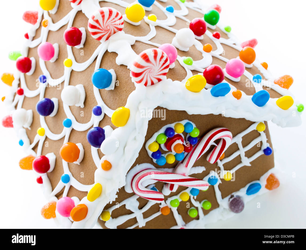 Decorated gingerbread house on white background Stock Photo - Alamy