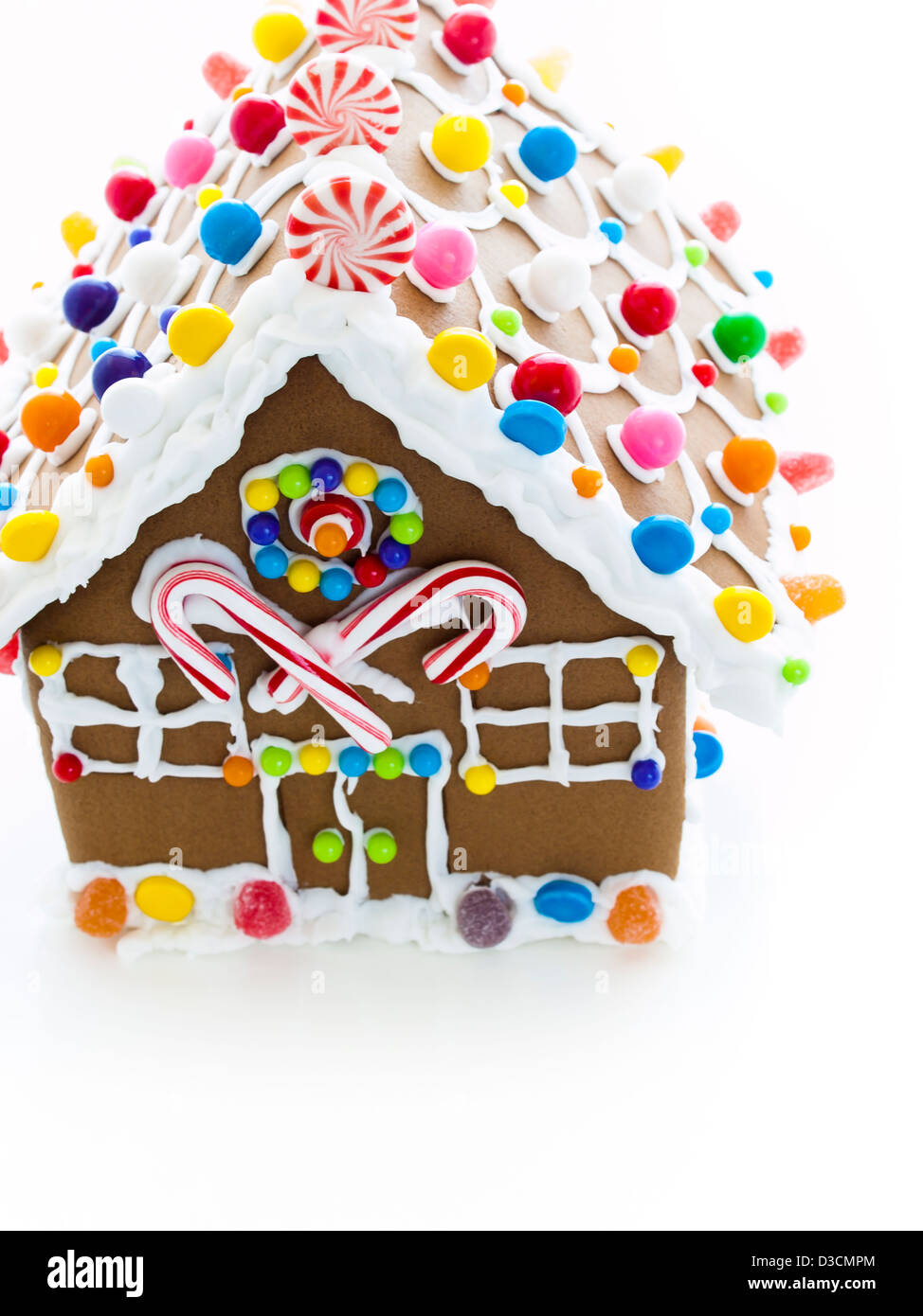 Decorated gingerbread house on white background Stock Photo - Alamy