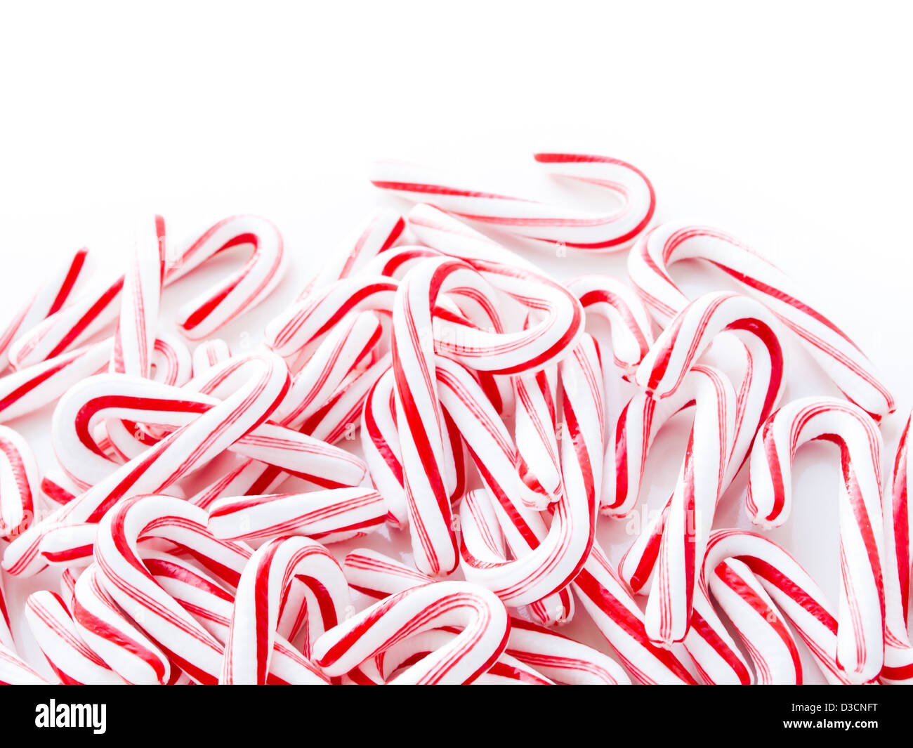 Peppermint candy canes on white background Stock Photo - Alamy