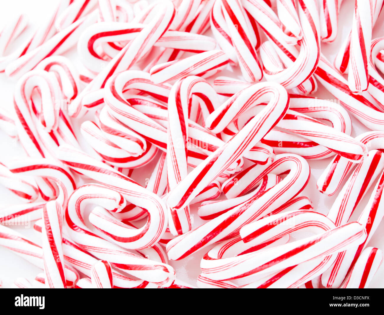 Peppermint candy canes on white background Stock Photo - Alamy