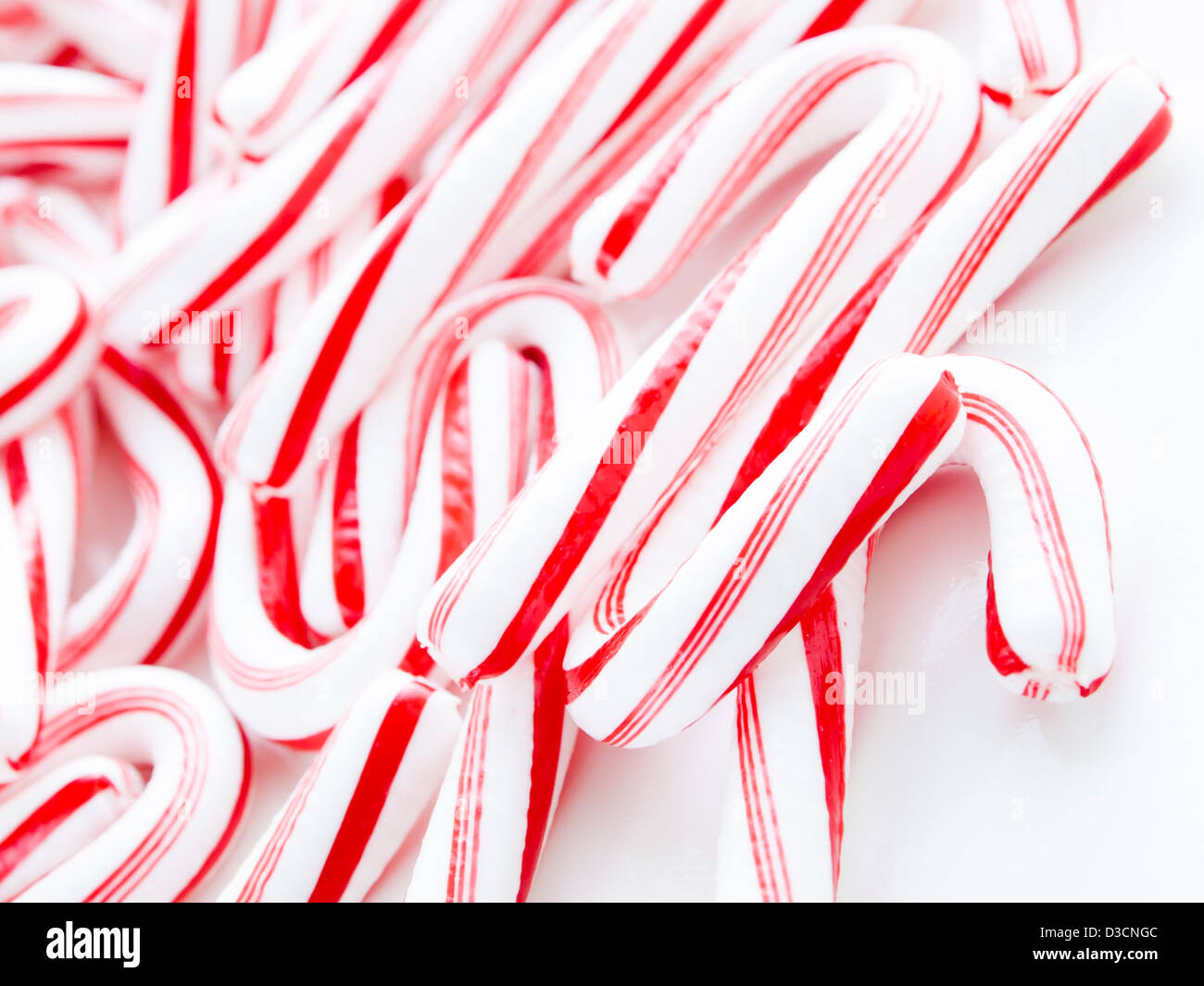 Peppermint candy canes on white background Stock Photo - Alamy