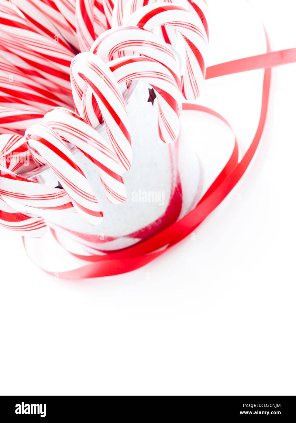 Peppermint candy canes in metal bucket on white background Stock Photo ...
