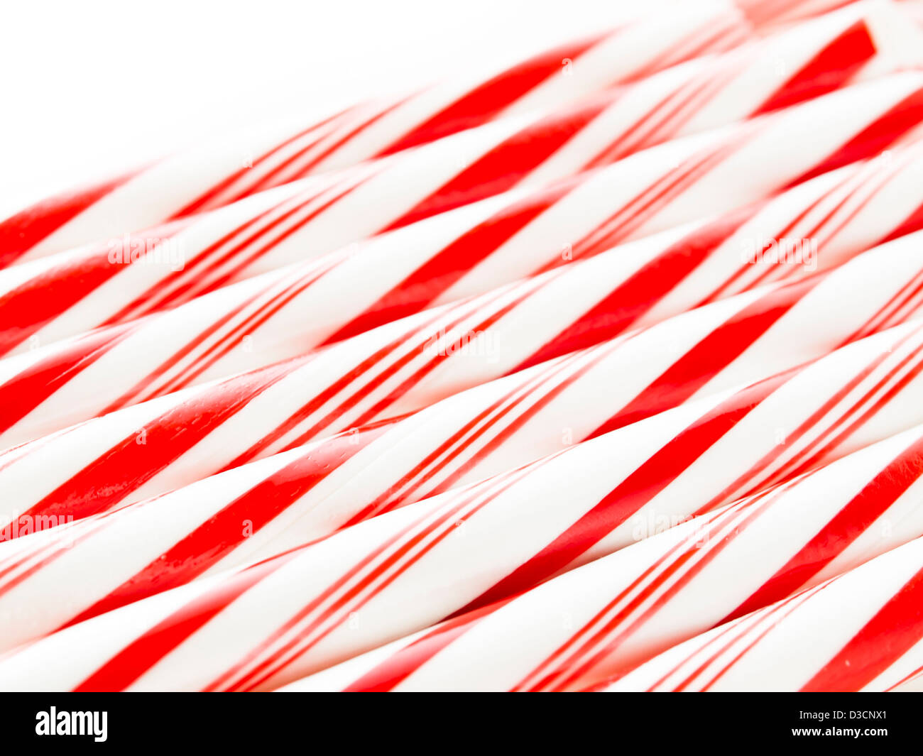 White and red peppermint candy canes in a row on white background Stock ...